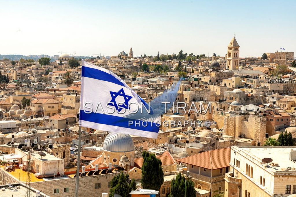 Jerusalem Israel flag above the roofs of the old city - sasson-photos.com